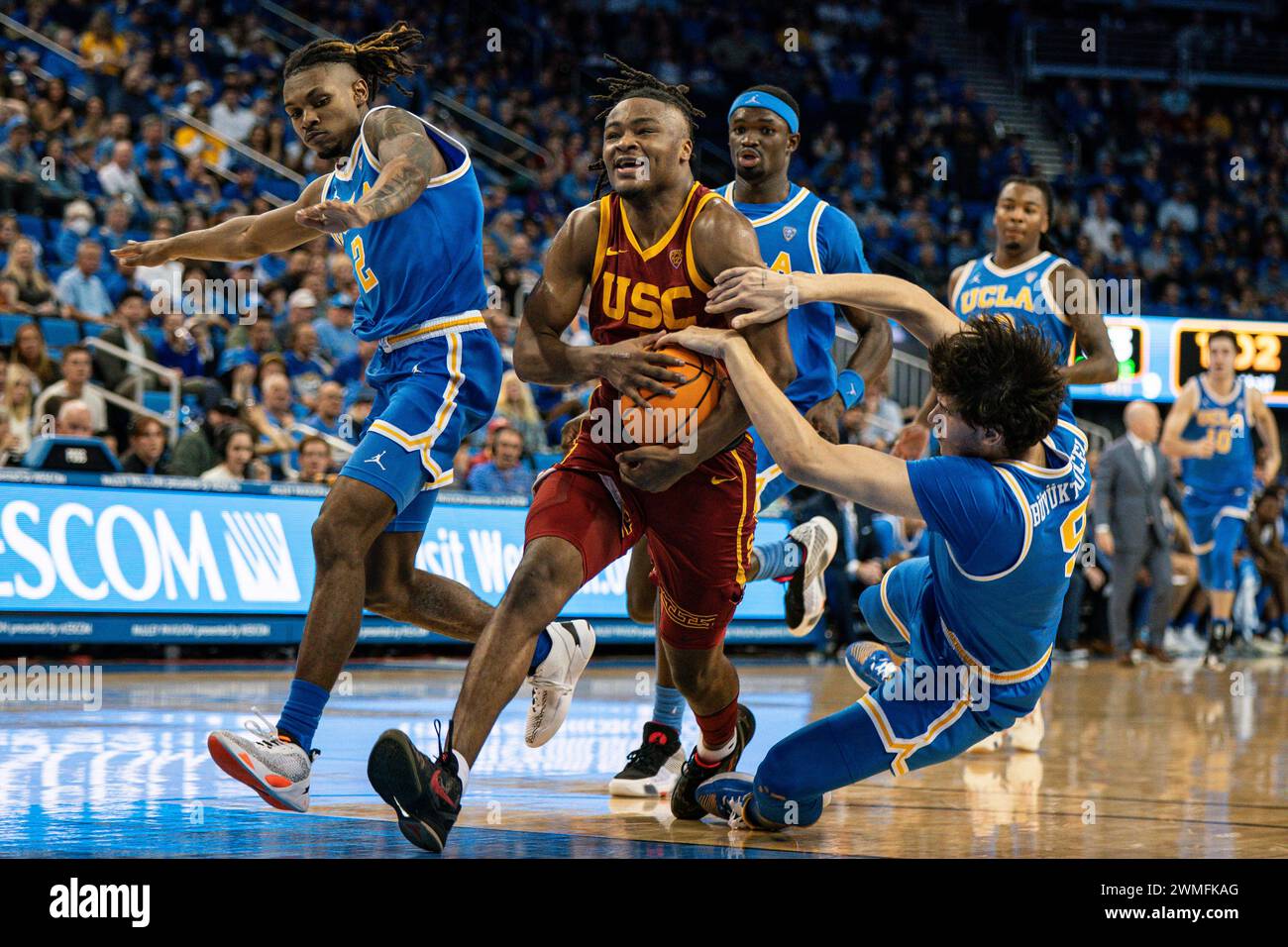 USC Trojans guard Isaiah Collier (1) is fouled by UCLA Bruins forward ...