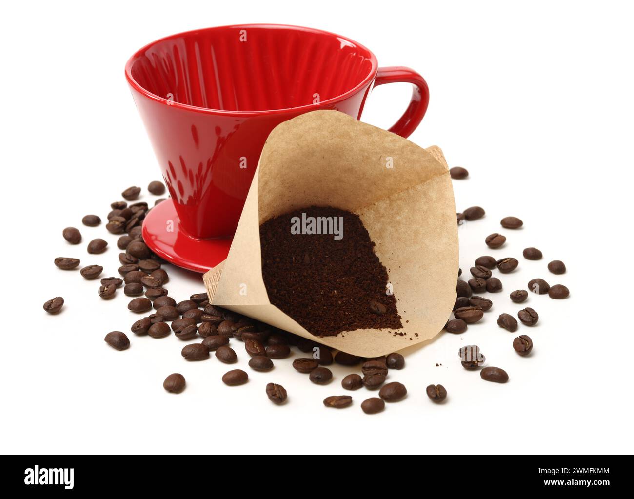 Coffee cone with filter paper full of coffee on white background Stock ...