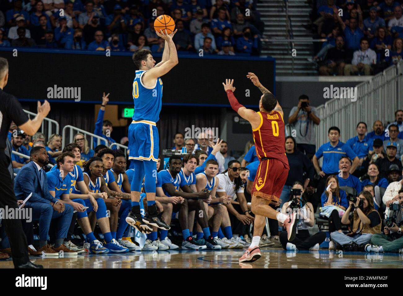 UCLA Bruins guard Lazar Stefanovic (10) shoots over USC Trojans guard ...