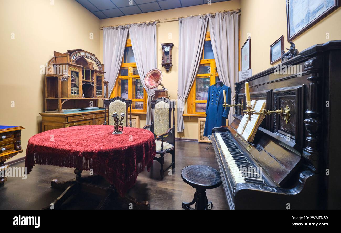 A recreation of a Tsarist era, rich, fancy living room with piano. At ...