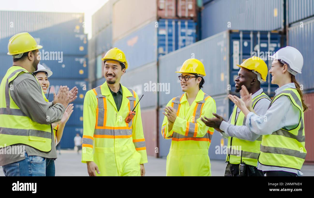 A diverse group of dock workers cheerfully clapping after a productive day Stock Photo - Alamy