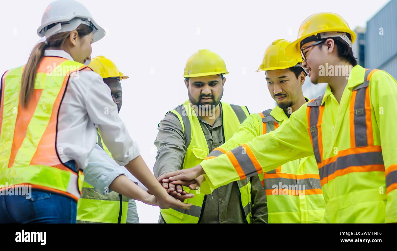 The dock workers stand with their hands together in the container ...