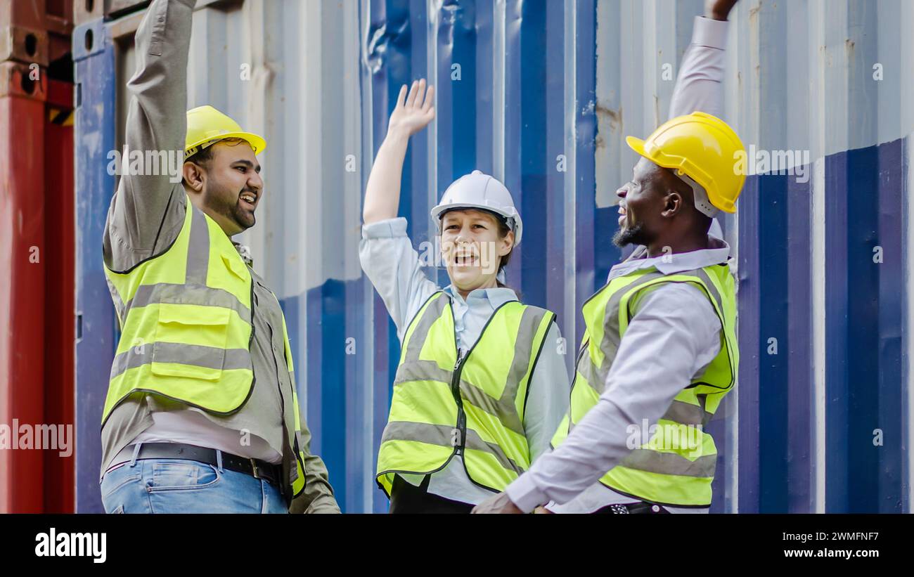 The team of cheerful dock workers in a container terminal. Thailand ...