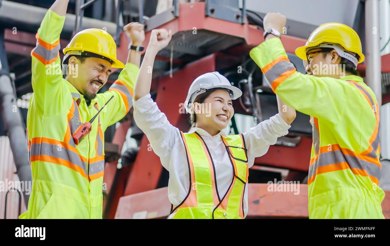 The team of cheerful dock workers in a container terminal. Thailand ...