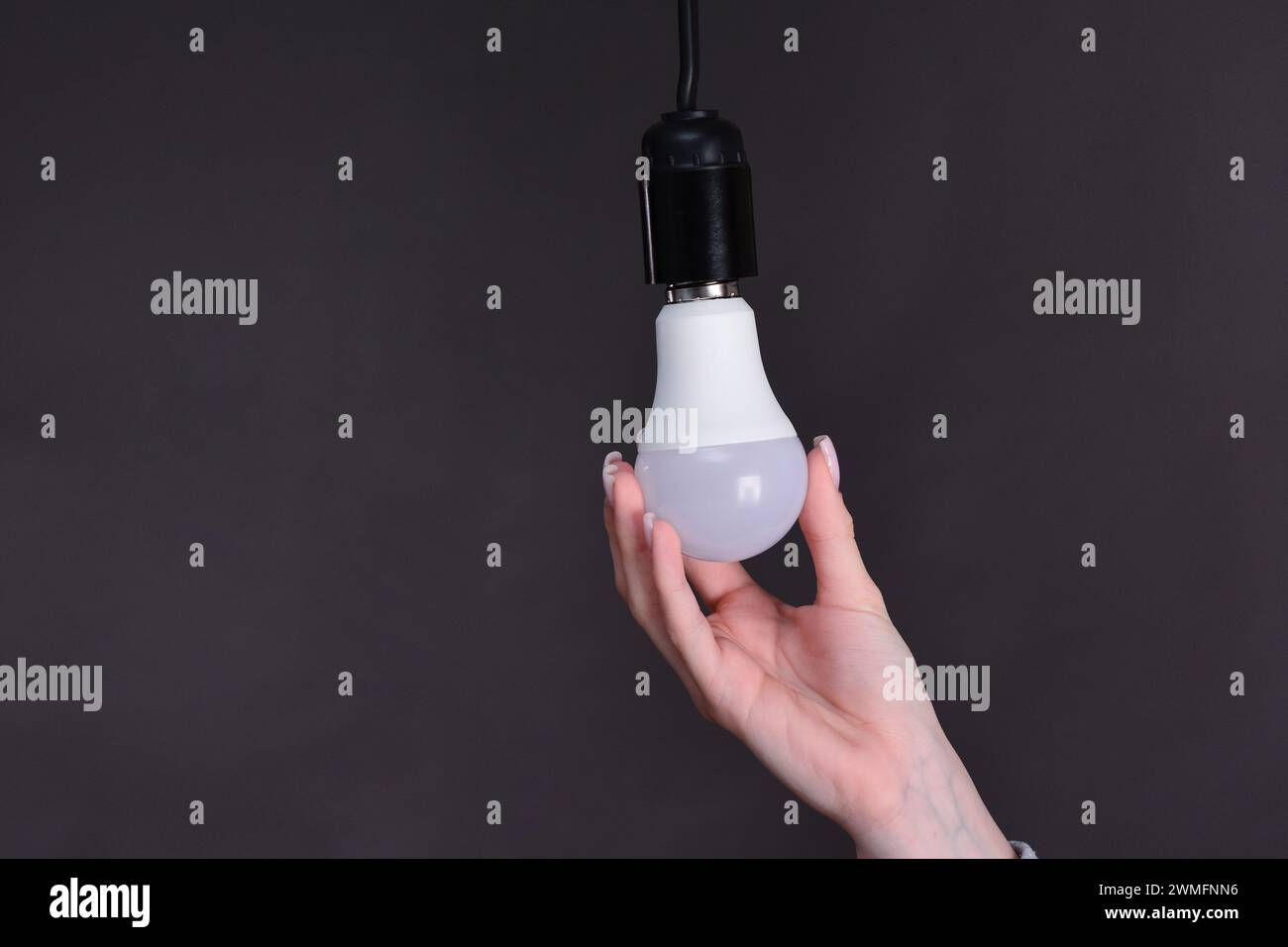 Hand changing light bulb close hi-res stock photography and images - Alamy