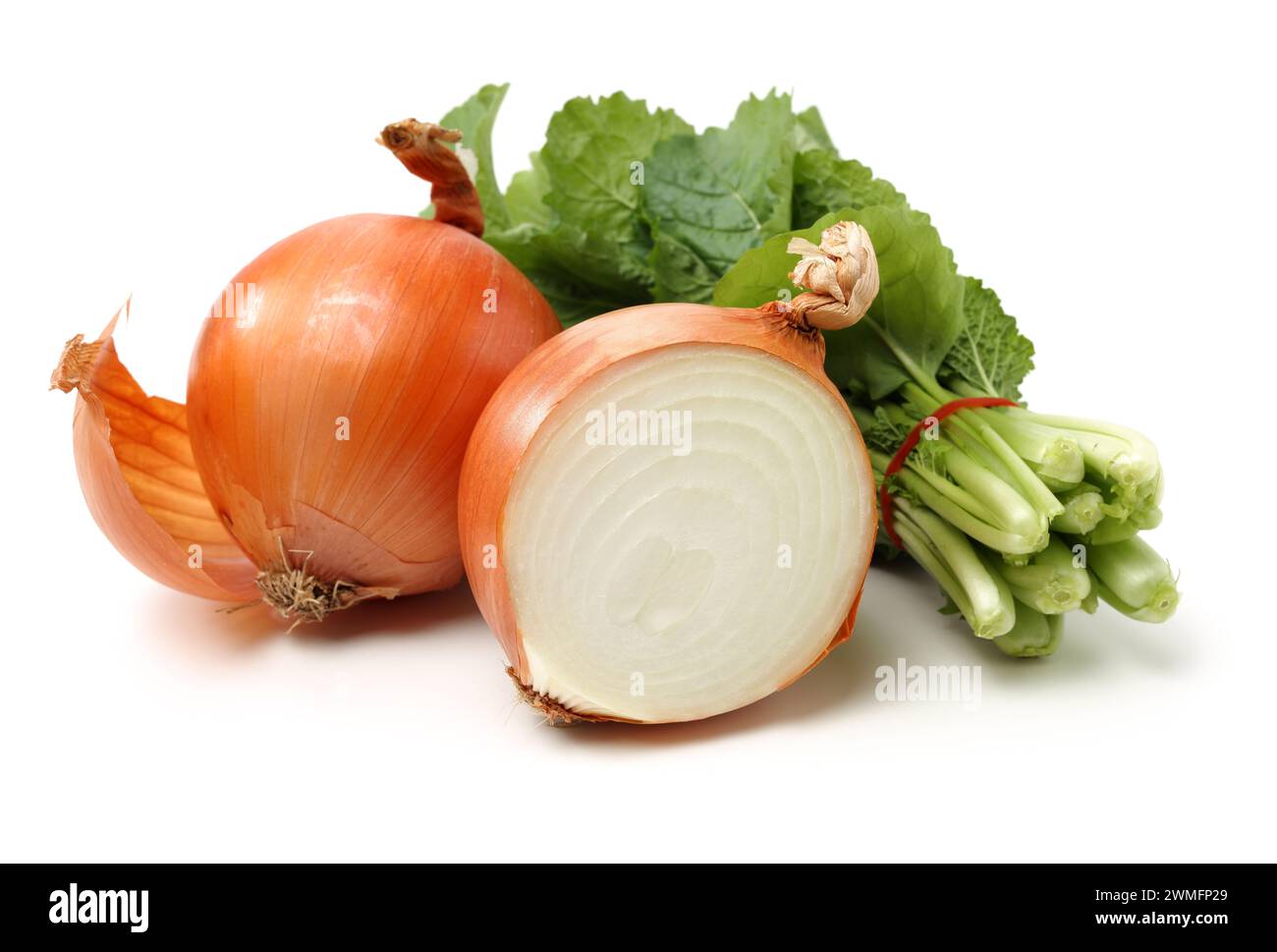 Gold onion vegetable bulbs on white background Stock Photo - Alamy