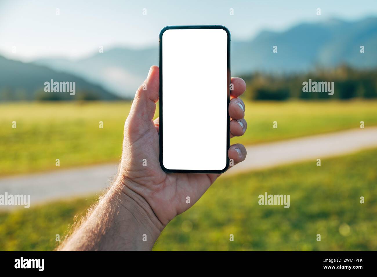 Smartphone Mockup Man Holding Mobile Phone With Blank White Screen As