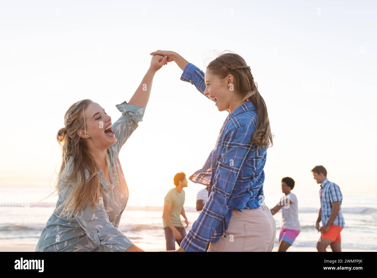 Women sunset beach hi-res stock photography and images - Alamy