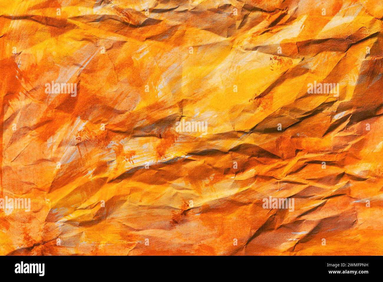 Texture of crumpled paper painted with yellow and orange aquarelle ...