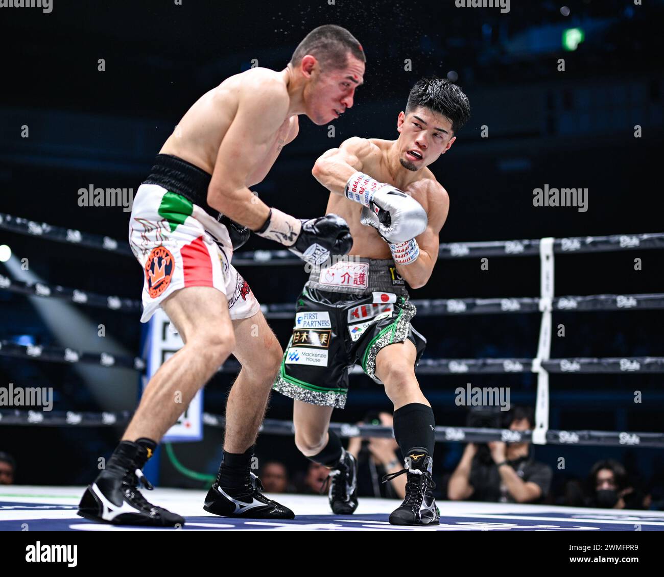 Kosei Tanaka (silver gloves) of Japan and Christian Bacasegua (black ...