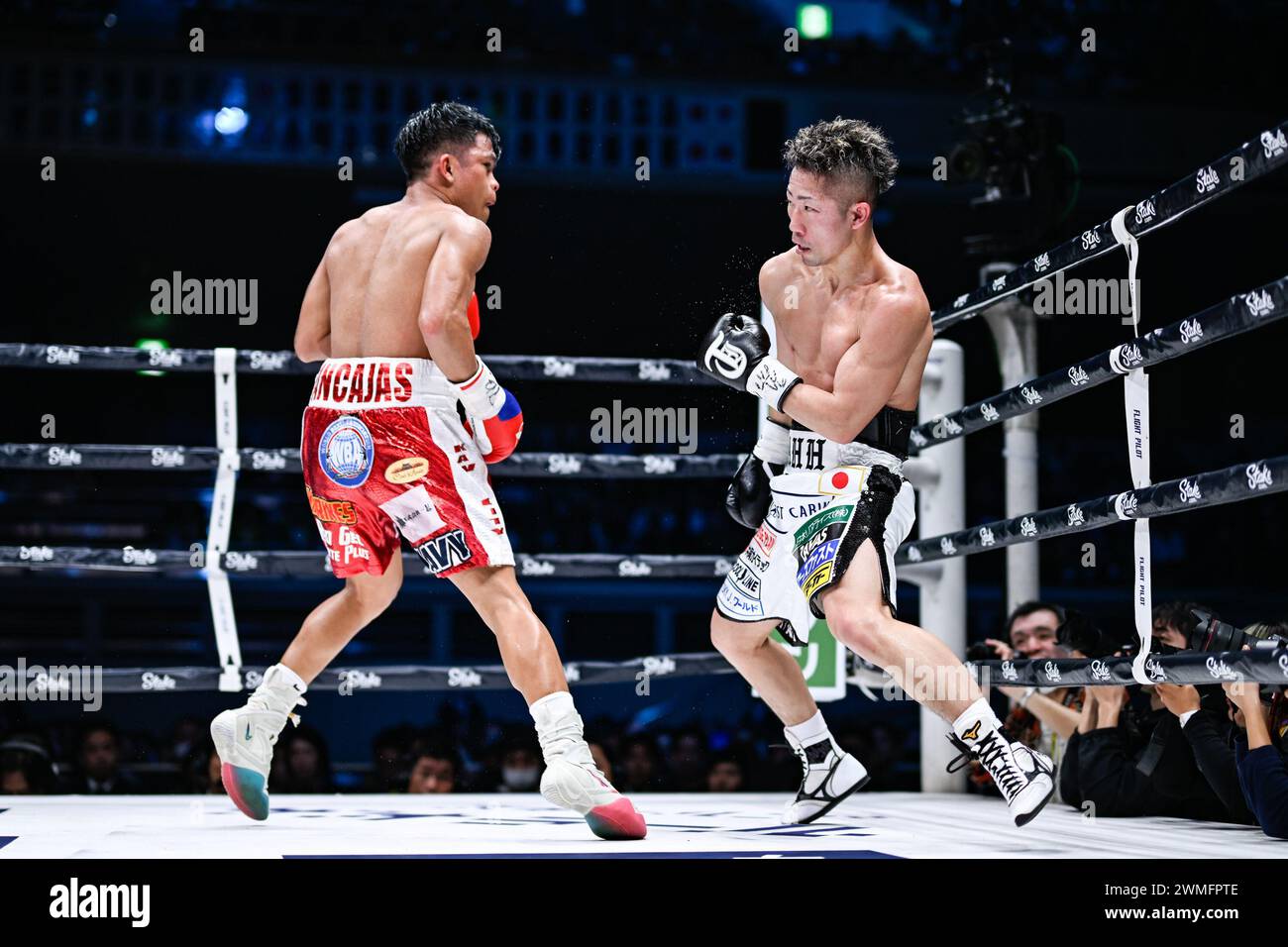 Champion Takuma Inoue (black gloves) of Japan and challenger Jerwin ...