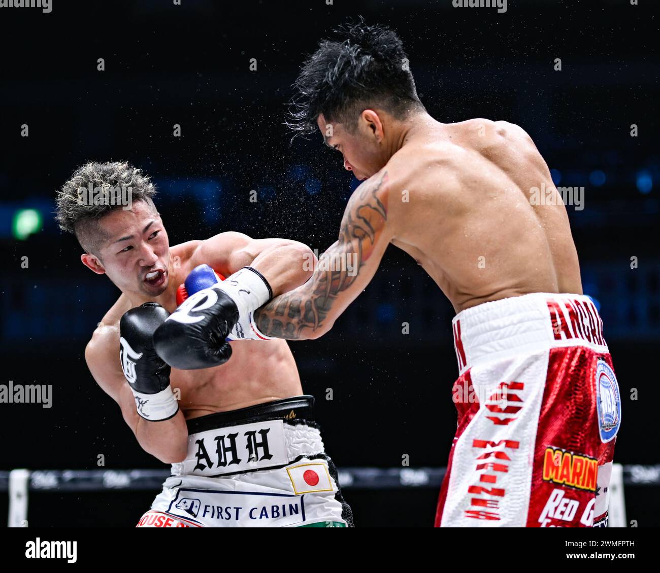 Champion Takuma Inoue (black gloves) of Japan and challenger Jerwin ...