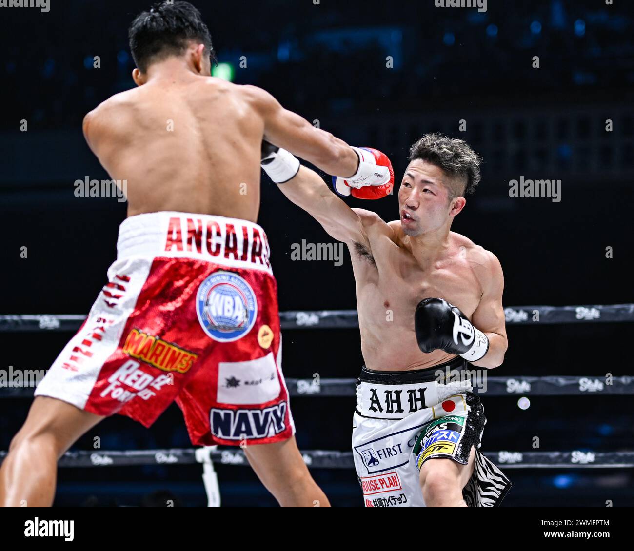 Champion Takuma Inoue (black gloves) of Japan and challenger Jerwin ...