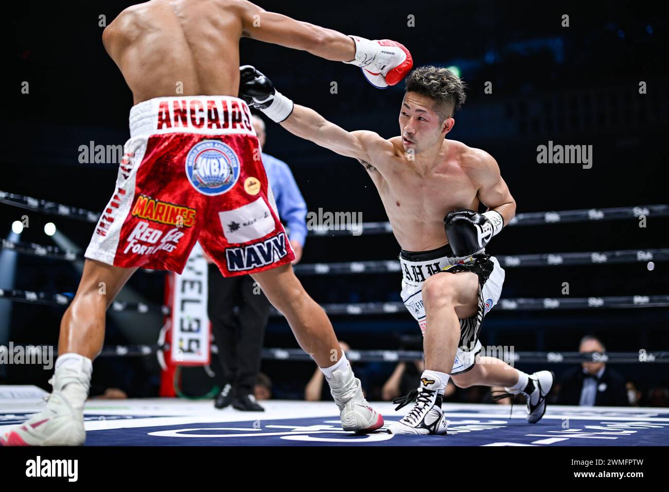 Champion Takuma Inoue (black gloves) of Japan and challenger Jerwin ...