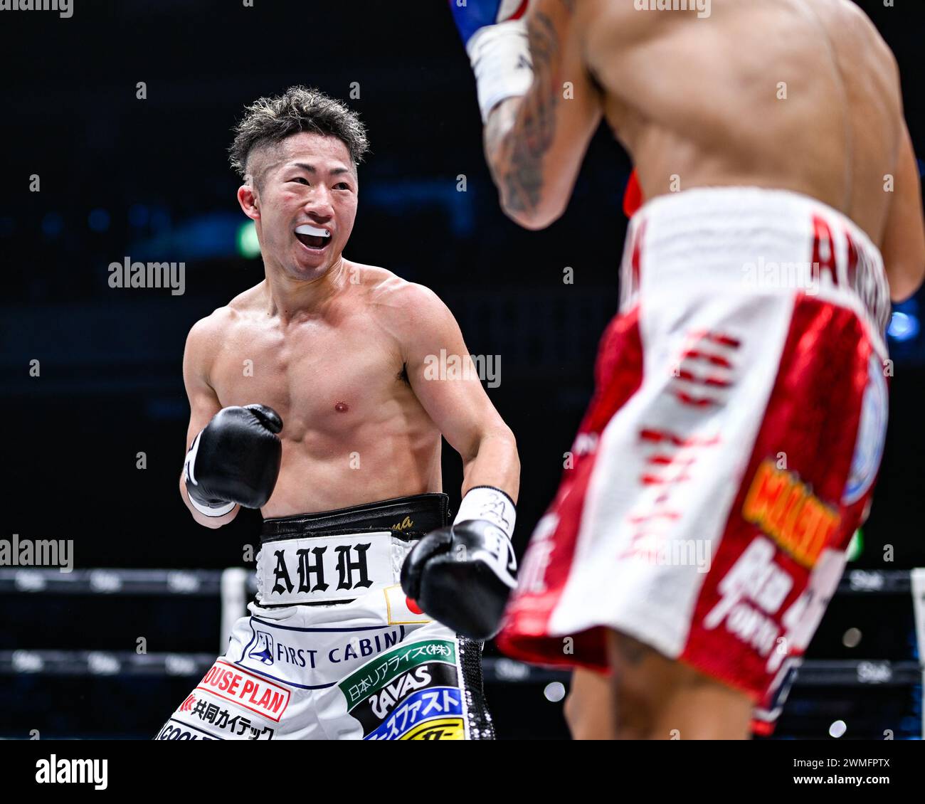 Champion Takuma Inoue (black gloves) of Japan and challenger Jerwin ...