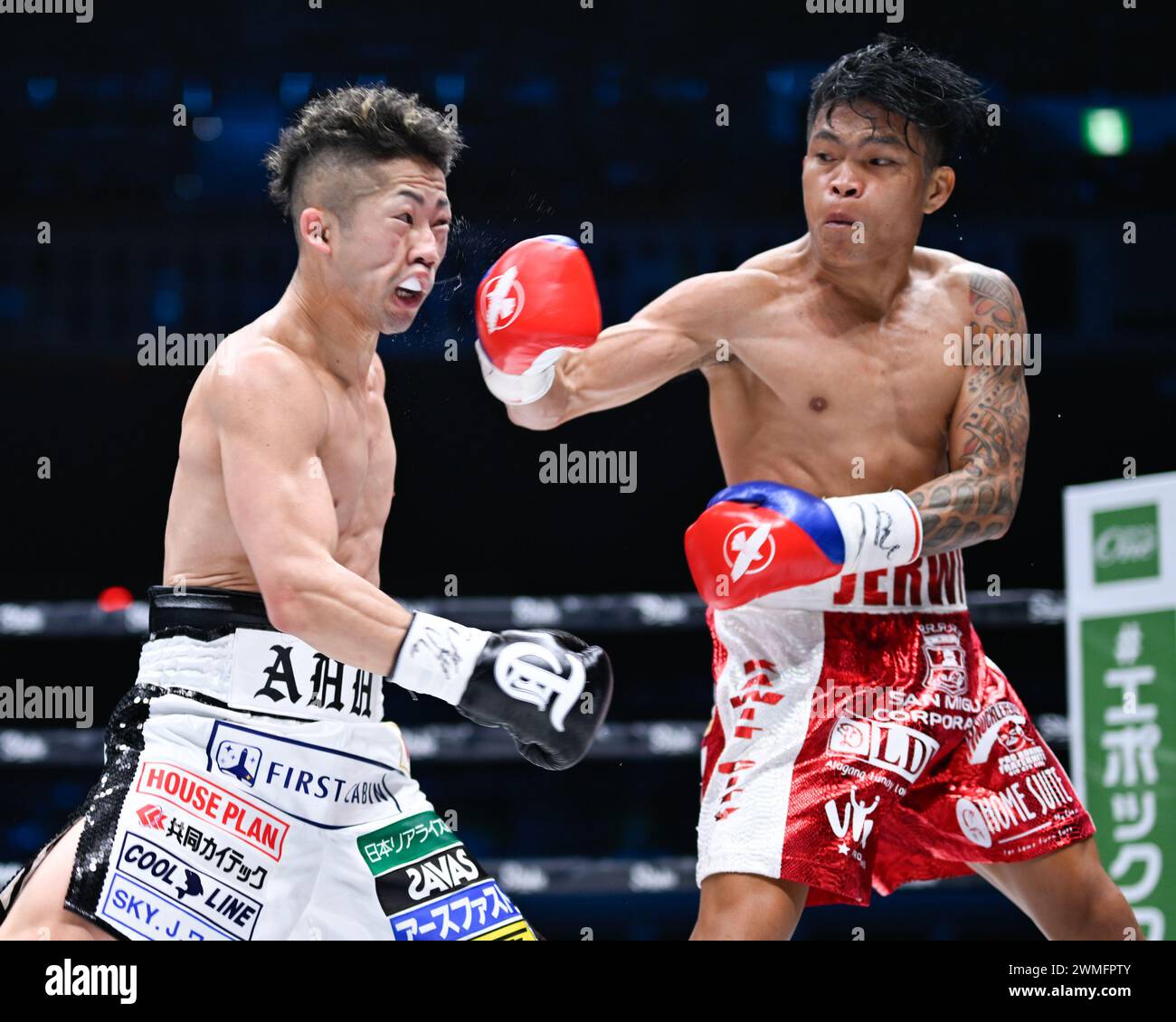 Champion Takuma Inoue (black gloves) of Japan and challenger Jerwin ...