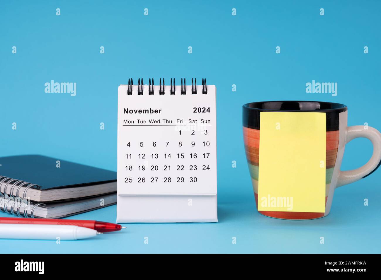 November 2024 desk calendar with adhesive note on cup of coffee Stock ...