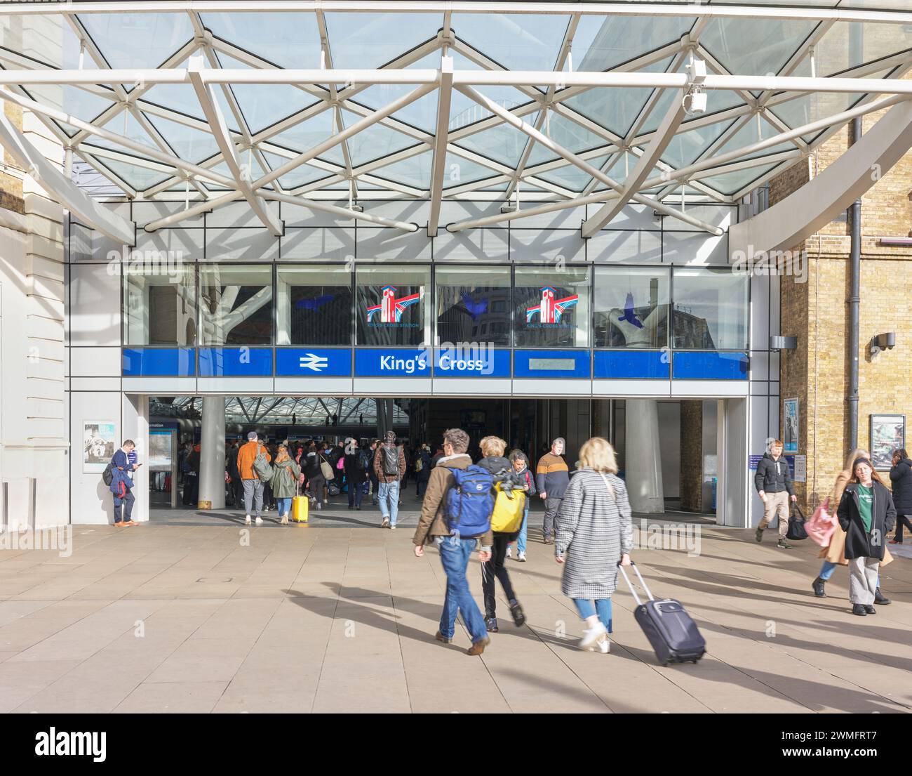 Passengers at King's Cross rail station, London, England Stock Photo ...