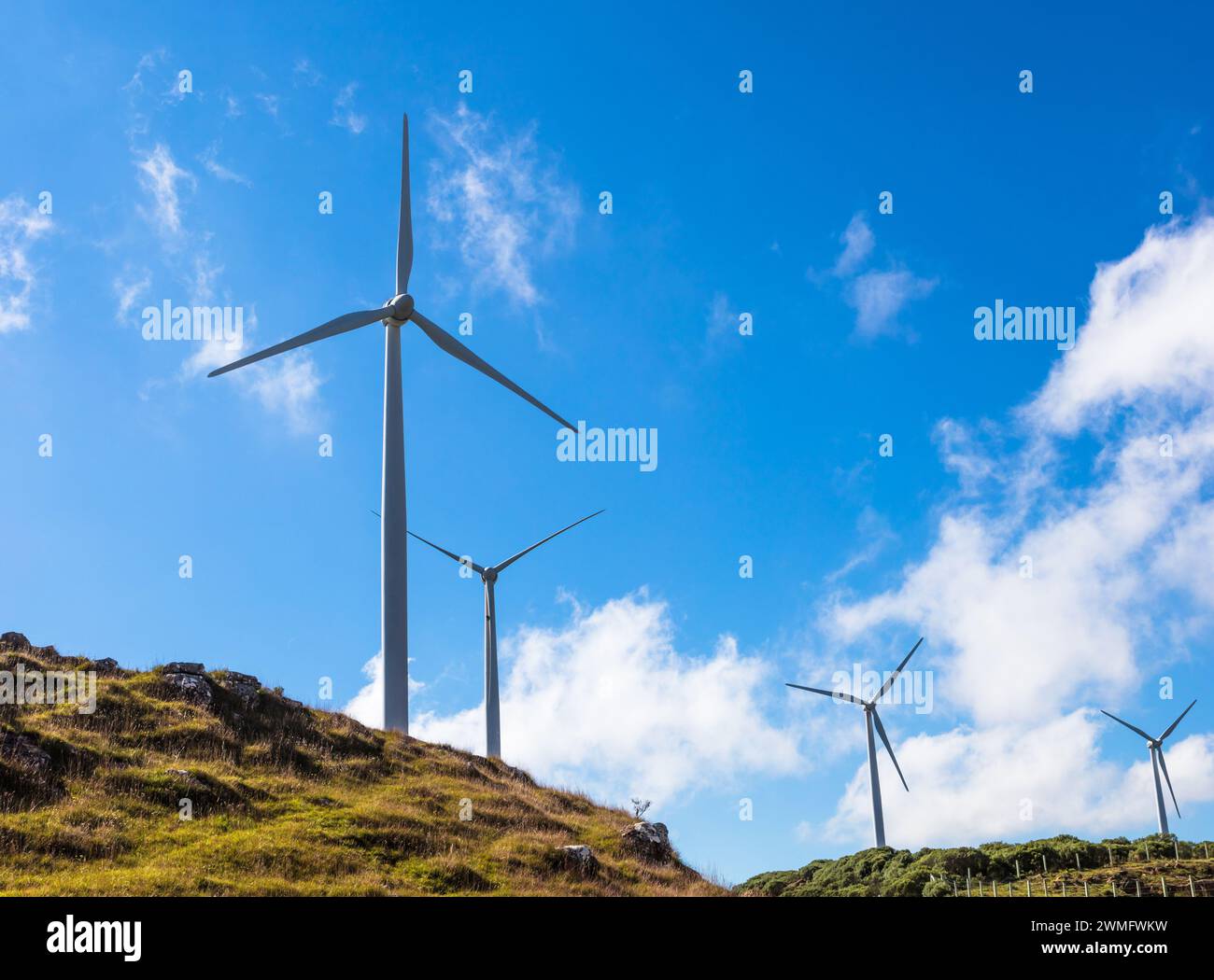 A Landscape with a wind turbine for power generation Stock Photo - Alamy