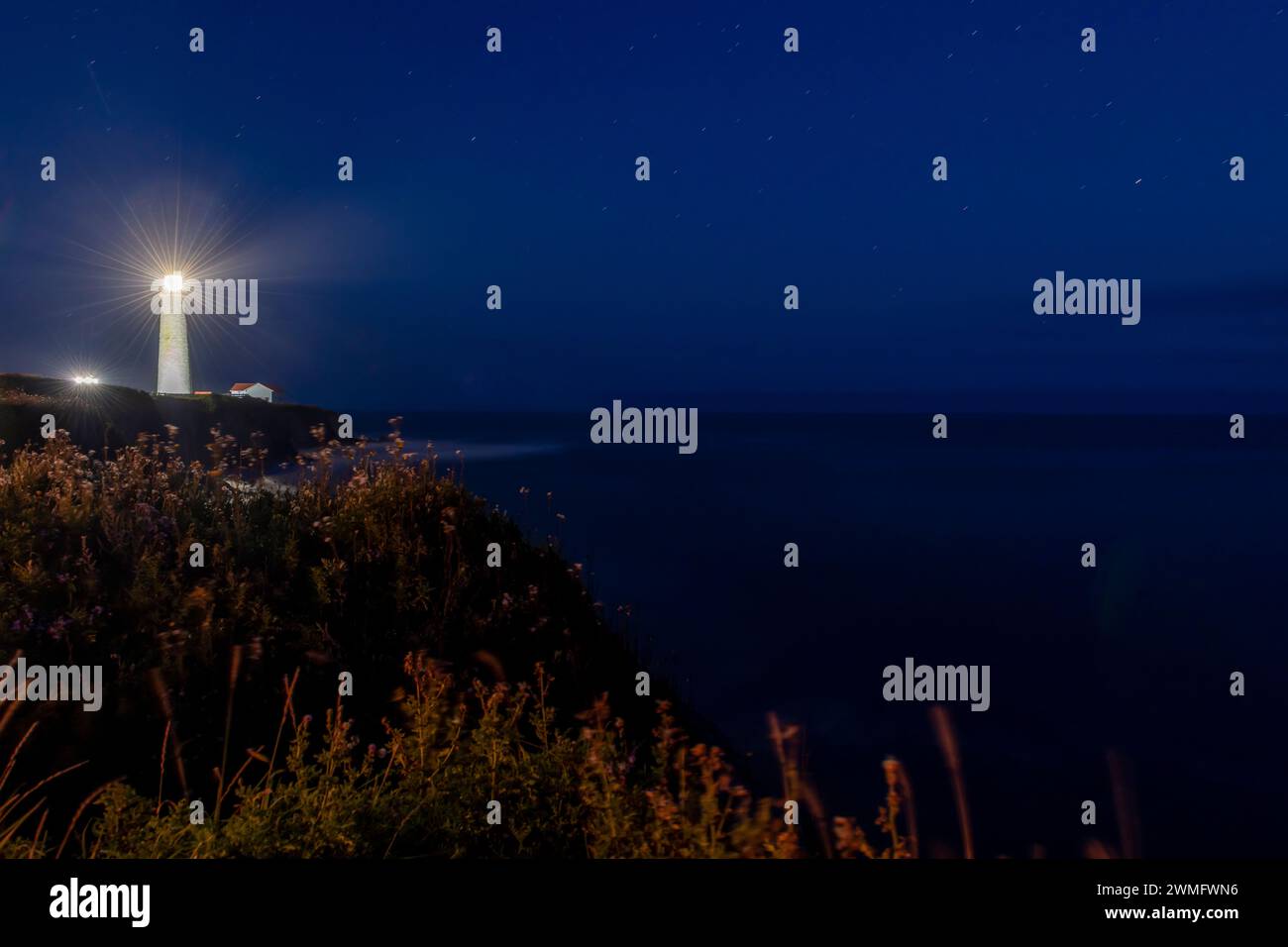 Witness the mesmerizing sight of the lighthouse standing tall against ...