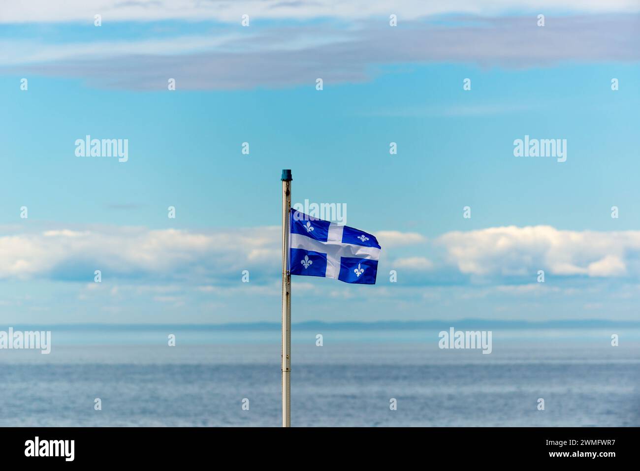 The flag of the Canadian province of Québec moves in the wind in the ...