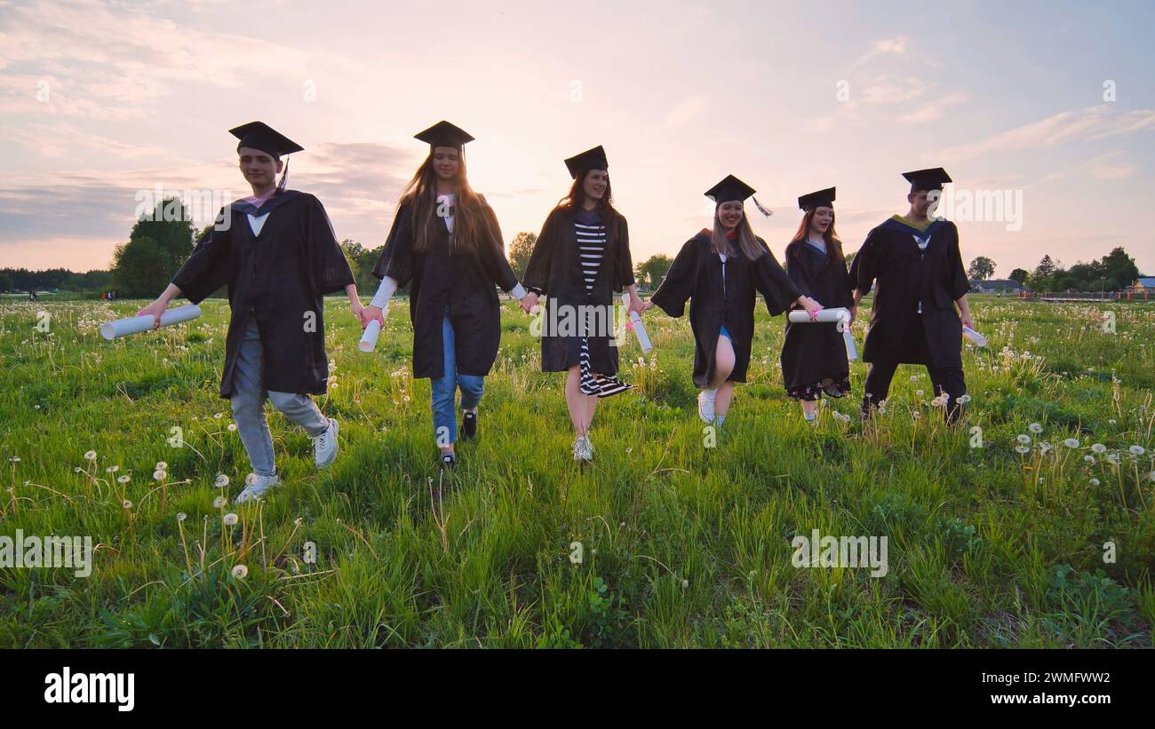 Male female walk to graduation hi-res stock photography and images - Alamy