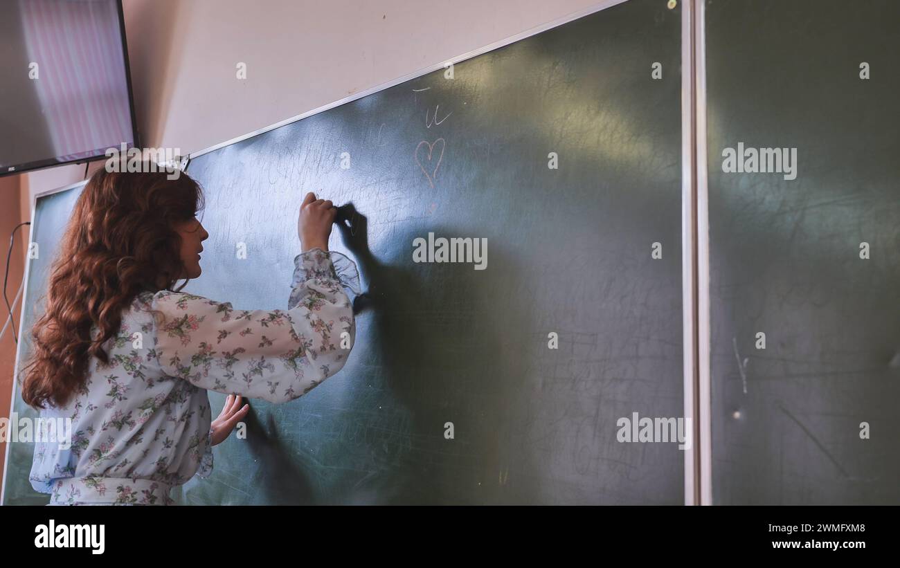 Teen student writes on the board hi-res stock photography and images ...