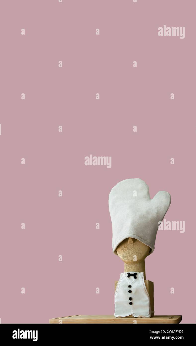 Chef's profile. A wooden bust sculpture with a miniature linen apron ...