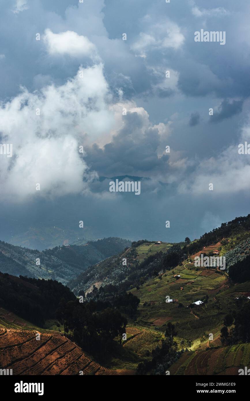 Storm clouds gather over green cultivated hills in Rwanda, Africa Stock ...