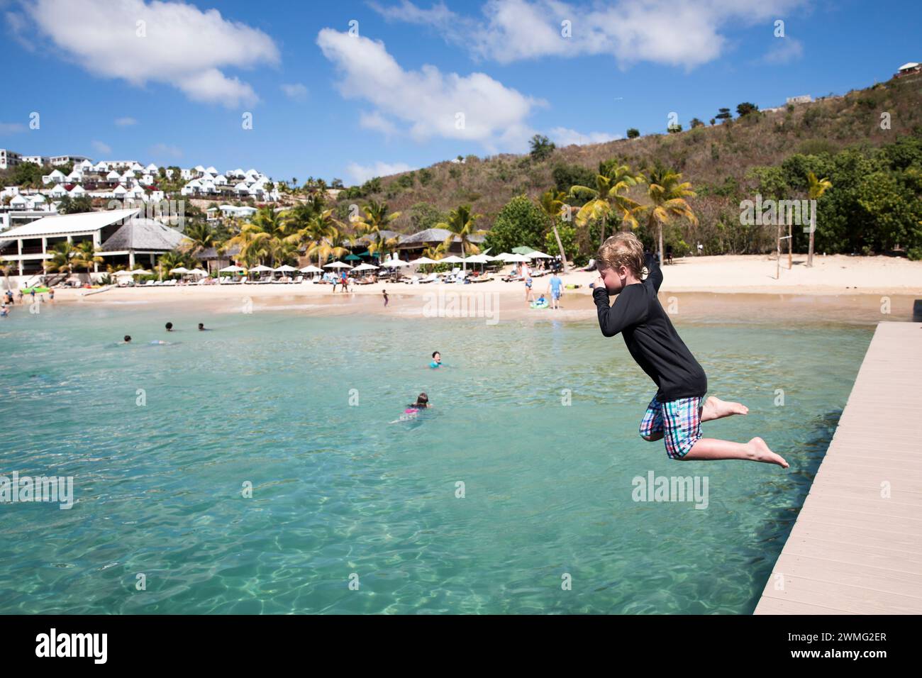 Boy jumping off pier hi-res stock photography and images - Alamy