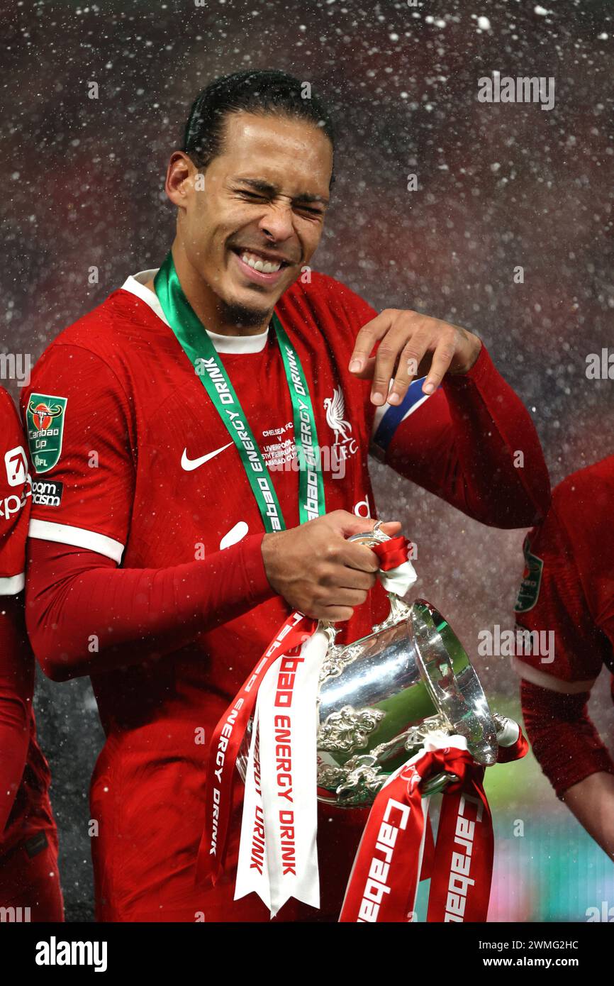 London, UK. 25th Feb, 2024. Virgil Van Dijk (L) celebrates at the ...