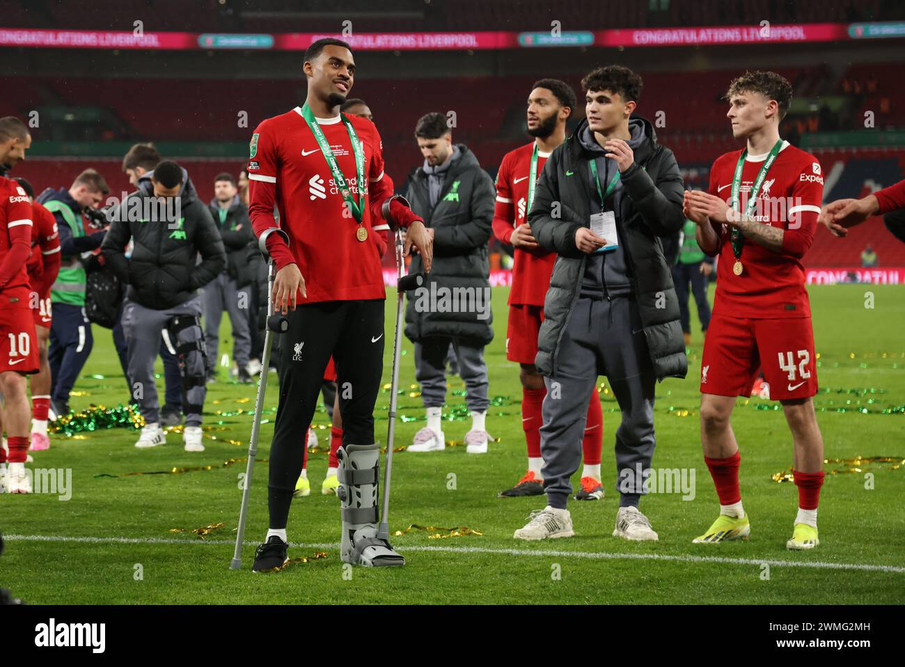 London, UK. 25th Feb, 2024. Ryan Gravenberch (L) on crutches at the ...