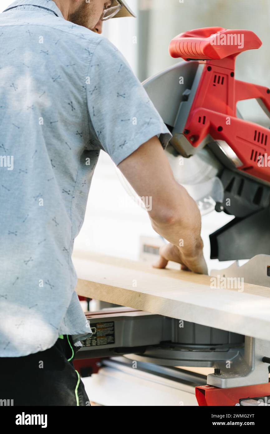Skilled carpenter cutting wood using hi-res stock photography and ...