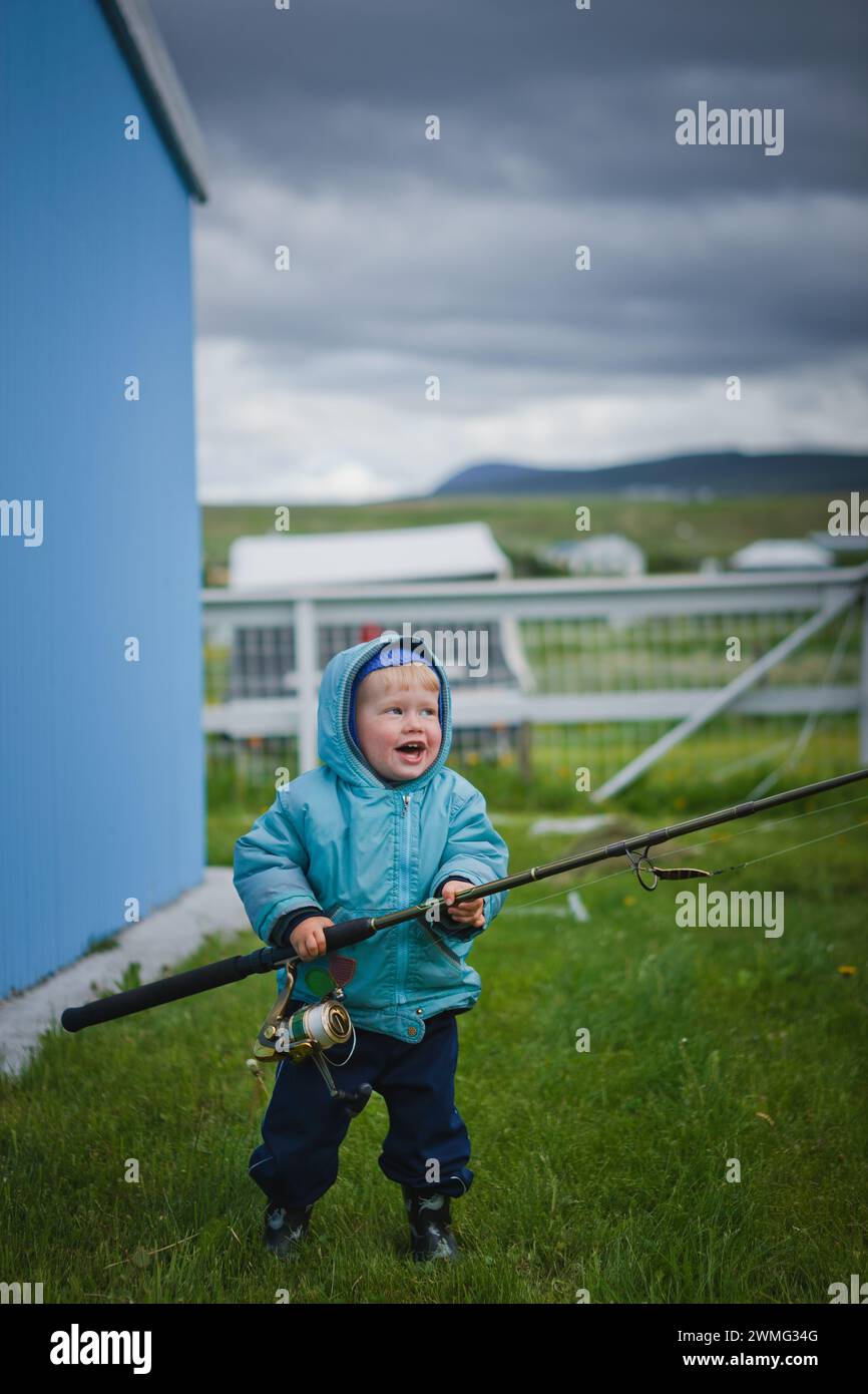Boy child kid with fishing pole hi-res stock photography and images - Alamy