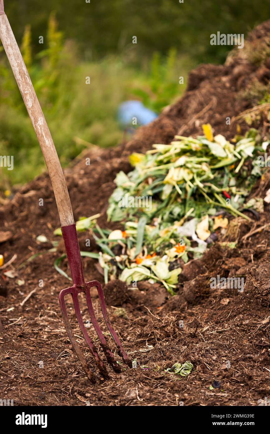 A pitchfork in the dirt Stock Photo - Alamy