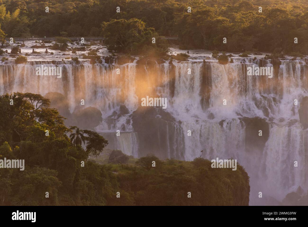 Beautiful sunset view to waterfalls and rainforest in Iguazu Falls ...