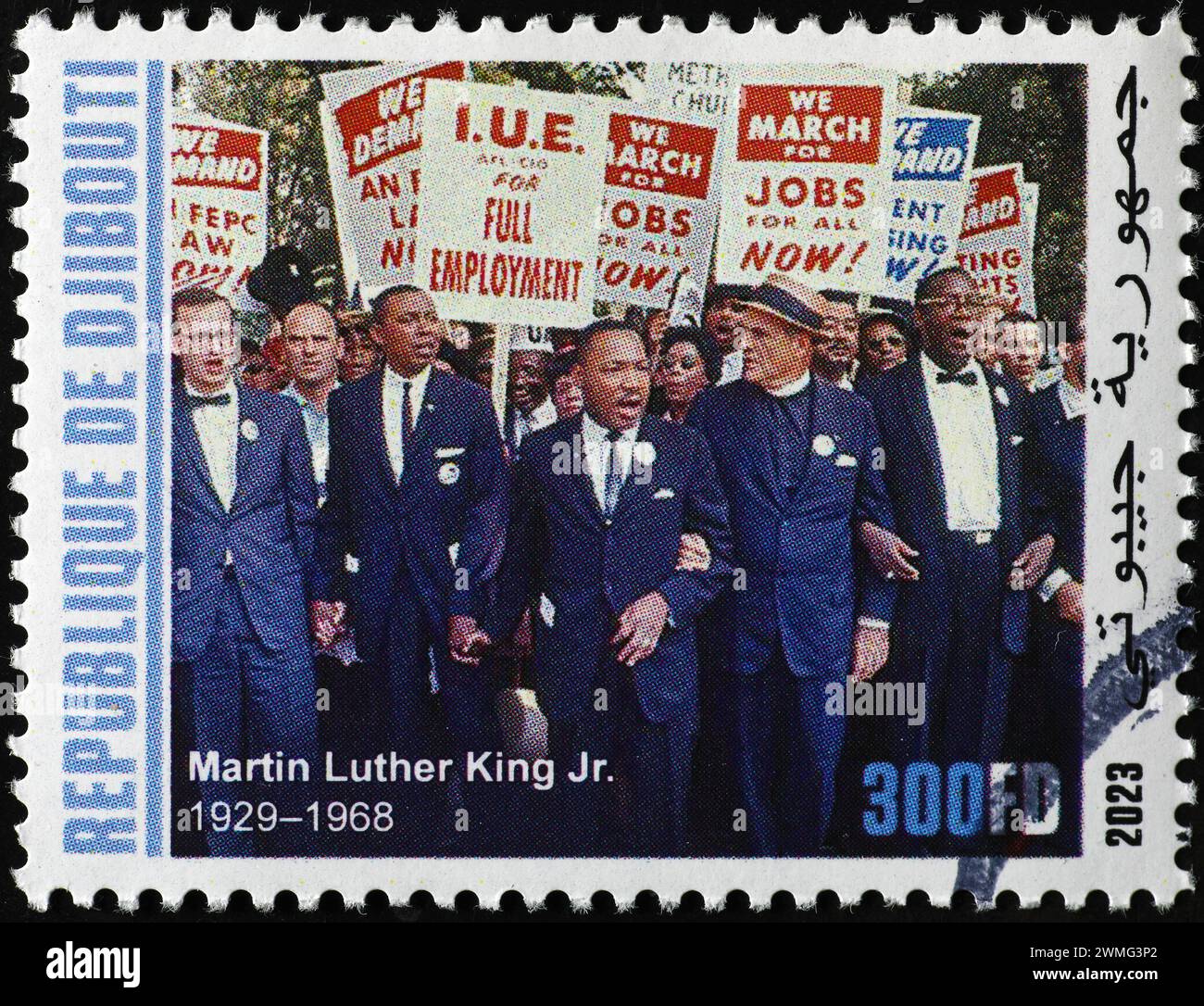 Martin Luther King during a protest march on postage stamp Stock Photo ...