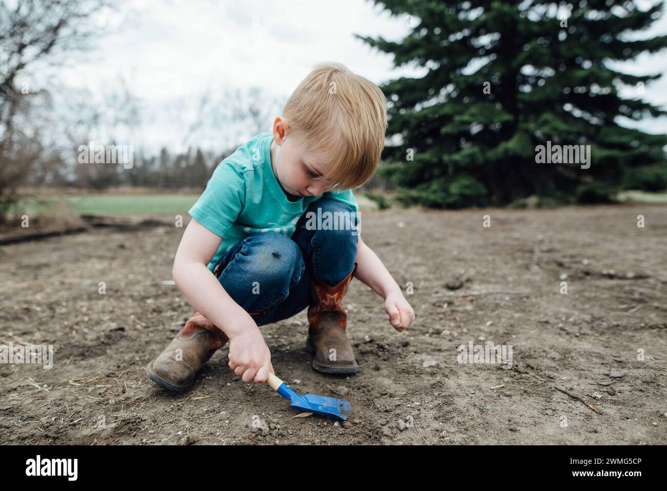 Boy squatting hi-res stock photography and images - Alamy