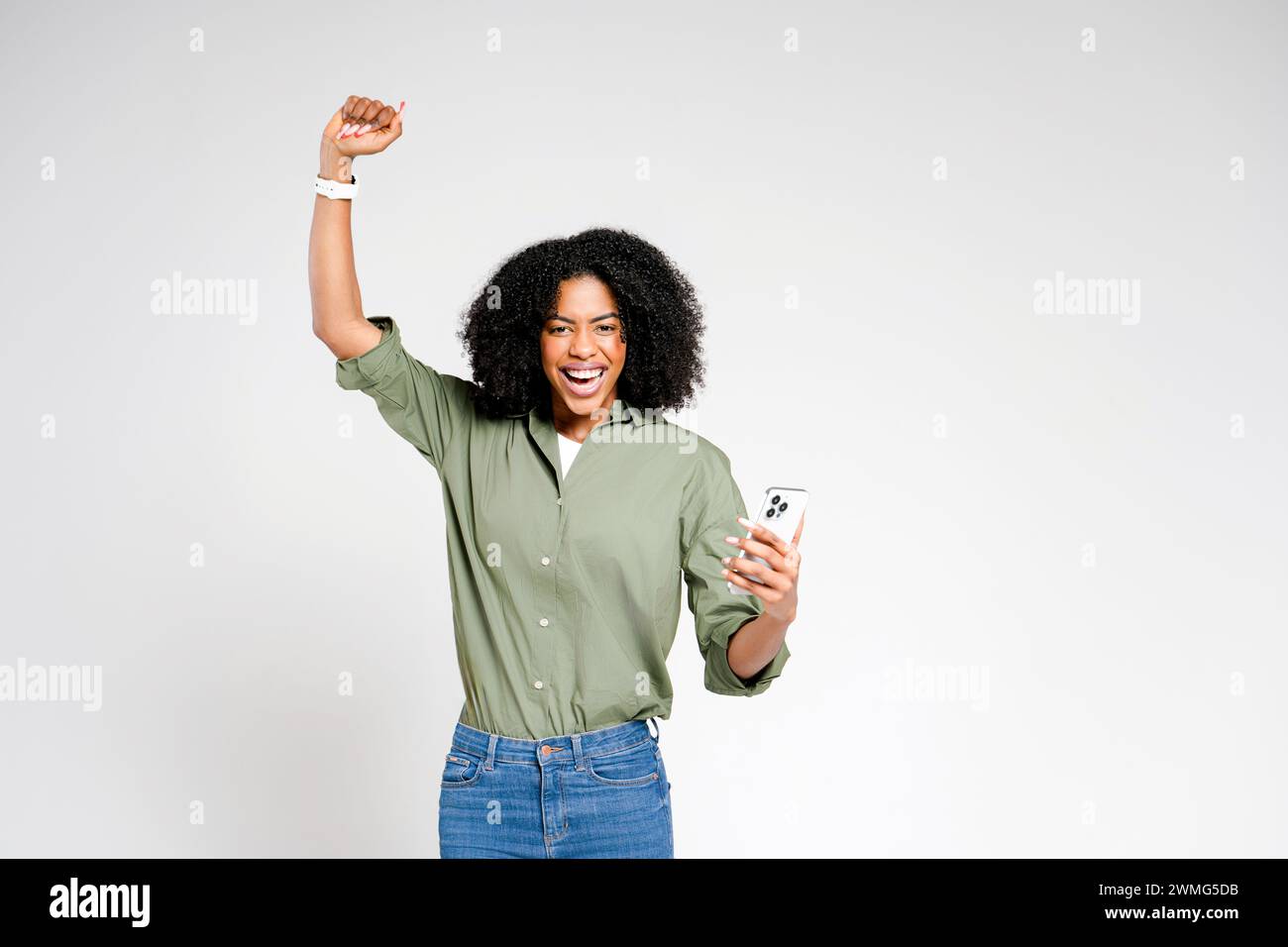 Female hand raises smartphone hi-res stock photography and images - Alamy