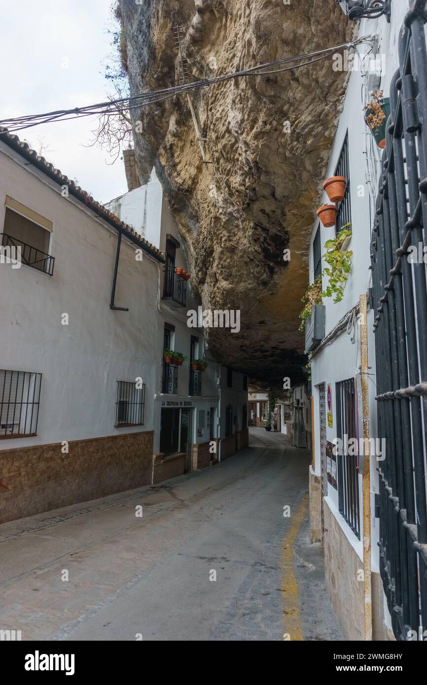 Typical andalusian village with white houses and street with dwellings ...