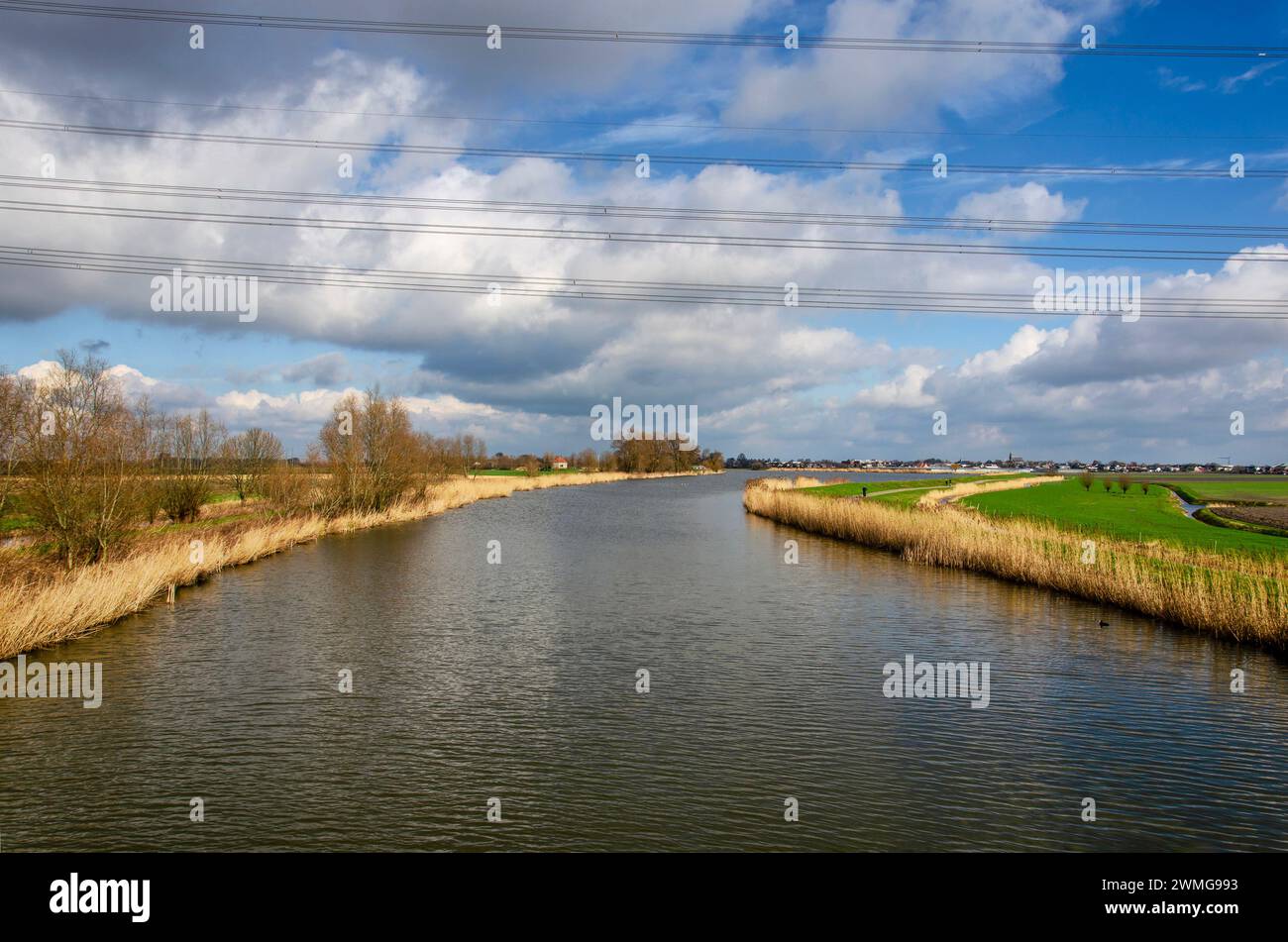 View under electricity wires of the river Rotte in the Netherlands ...