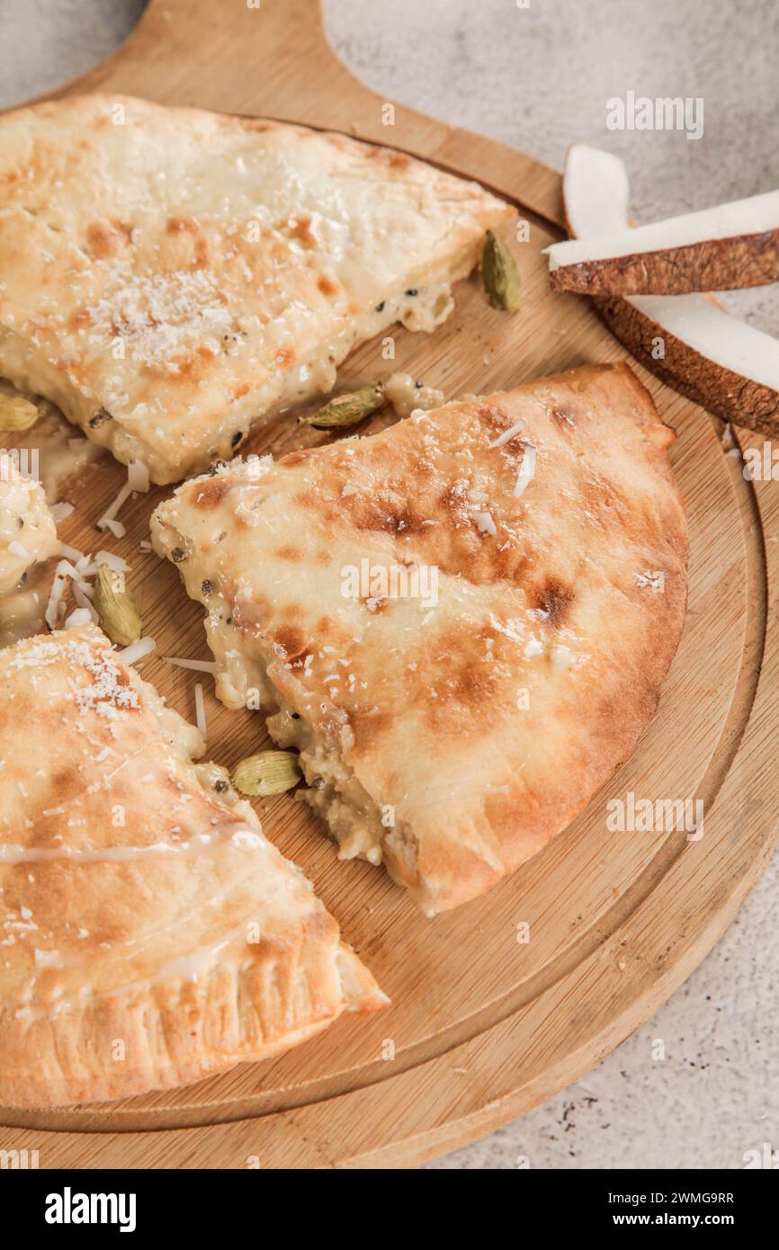 Sweet rabri stuffed naan, made in condensed milk with coconut toppings ...