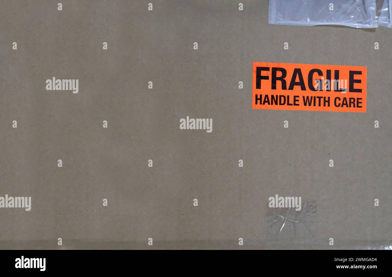 Cardboard package with the warning label "FRAGILE" on it Stock Photo ...