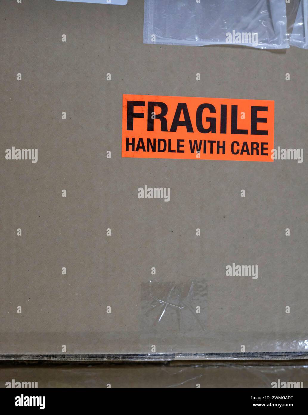 Cardboard package with the warning label "FRAGILE" on it Stock Photo ...