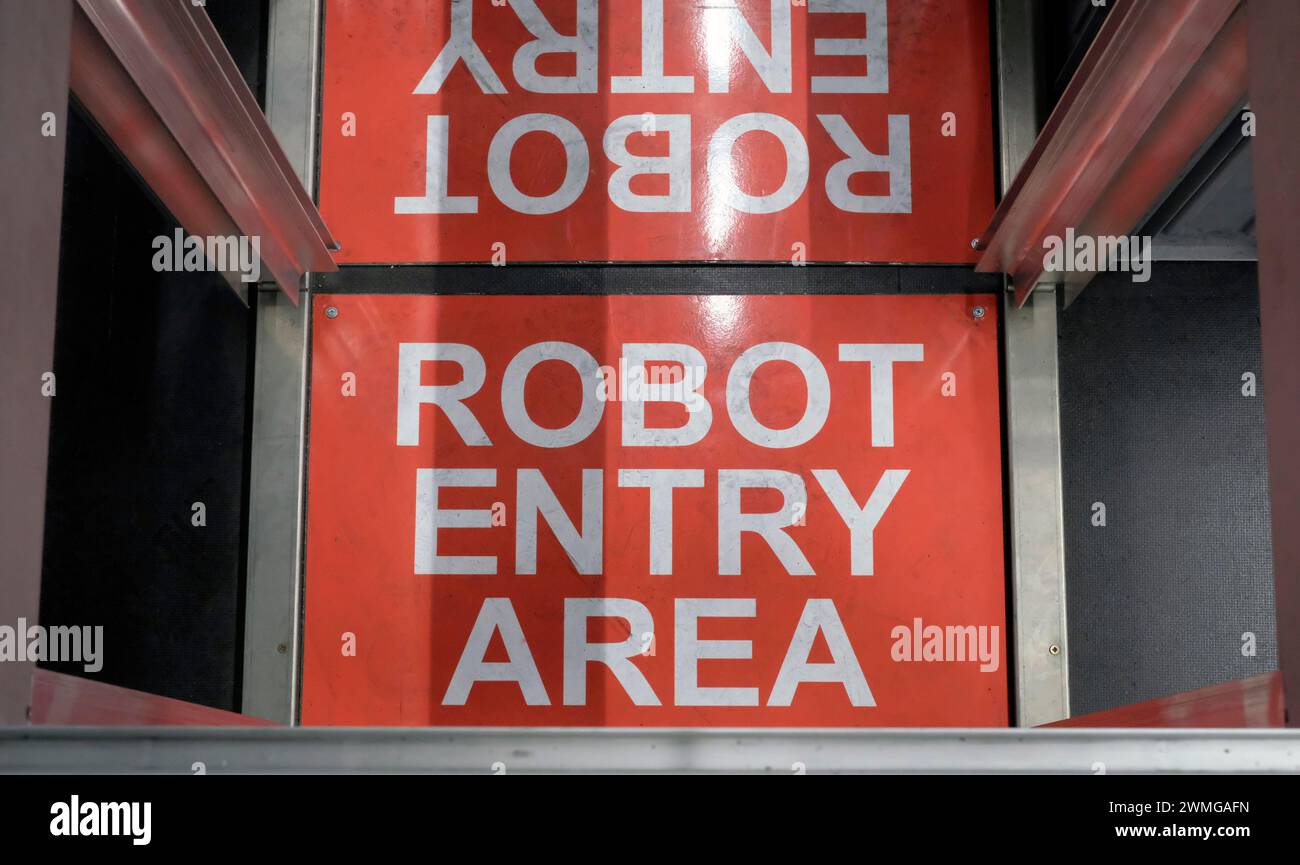 Warning sign on the floor in a logistics center - robot entry area ...