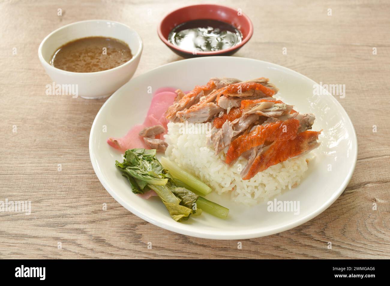 slice roasted duck topping rice with pink pickled ginger and boiled ...