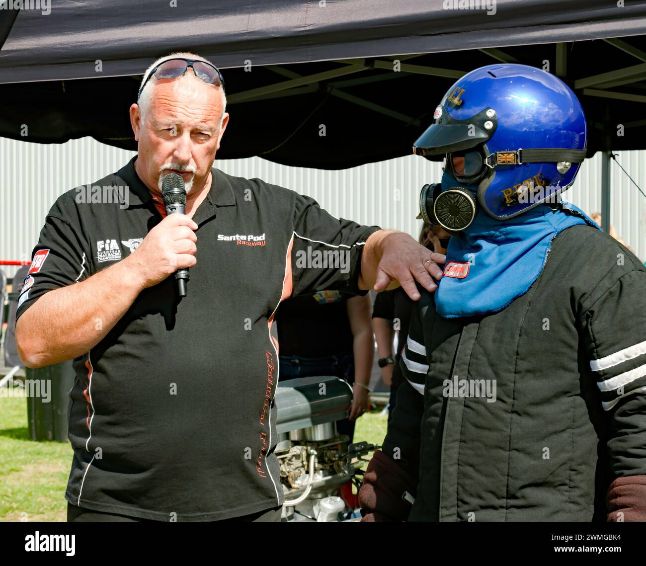 Driver of a Methanol Fuelled Dragster wearing protective gear, during ...