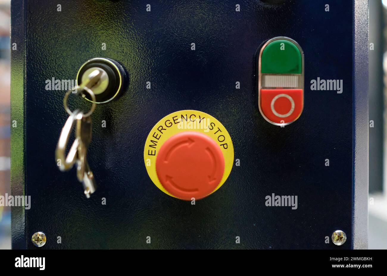 Button with the words EMERGENCY STOP next to a conveyor belt Stock ...
