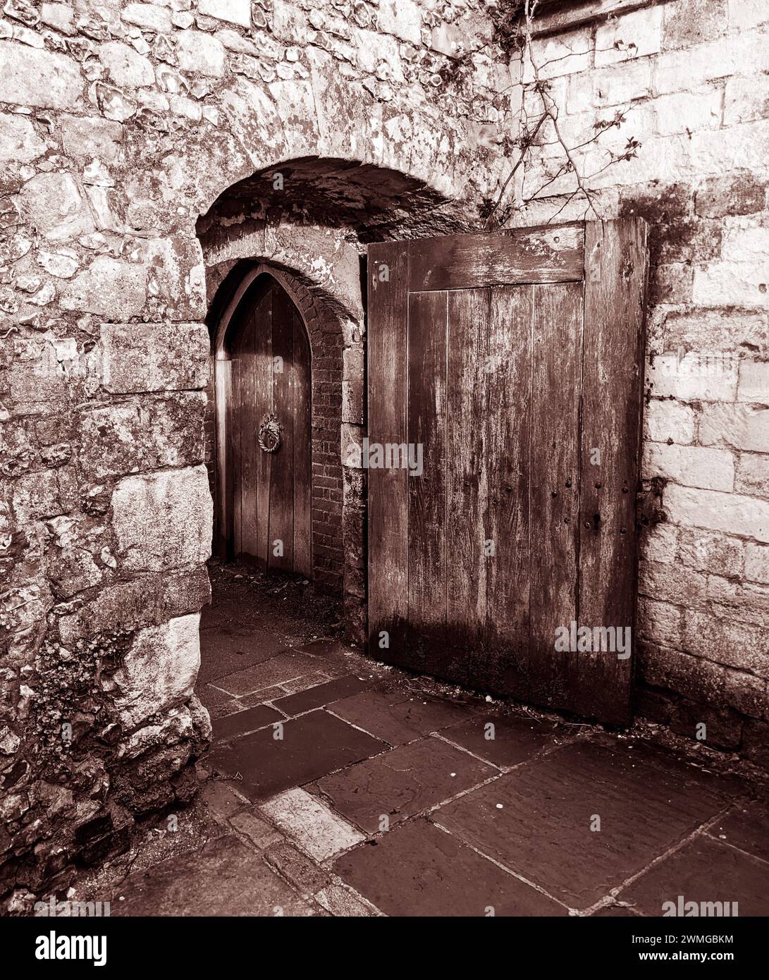 A Antique Historic Secret Door in a Stone Wall Stock Photo - Alamy