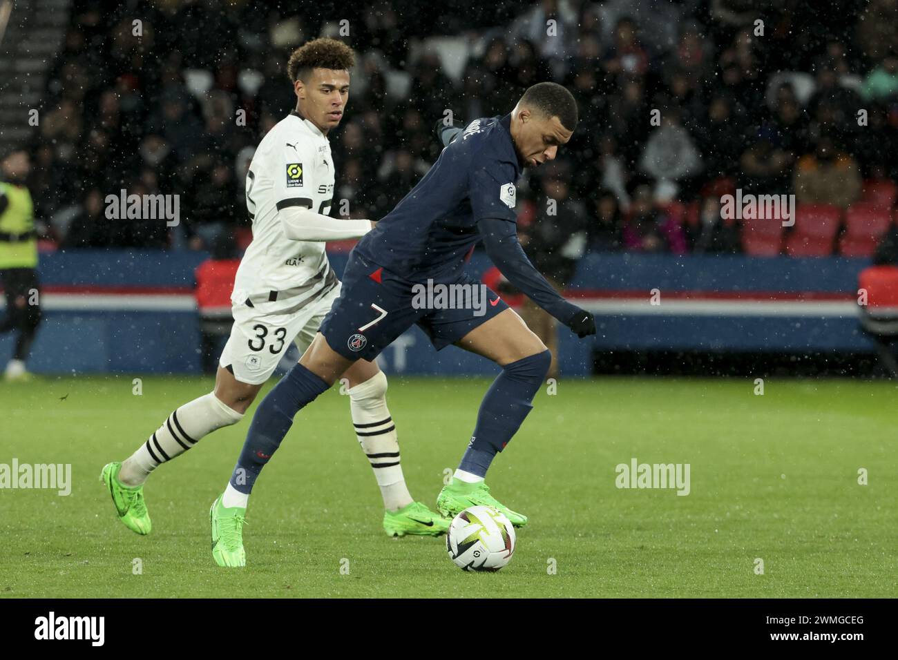 Kylian Mbappe of PSG, left Desire Doue of Rennes during the French ...